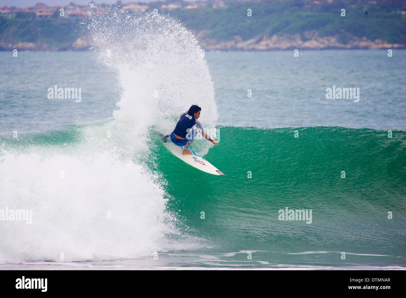 surfer on a surfboard riding a wave in the ocean sea water wave beach ...