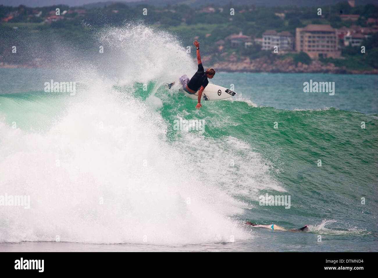 surfer on a surfboard riding a wave in the ocean sea water wave beach ...
