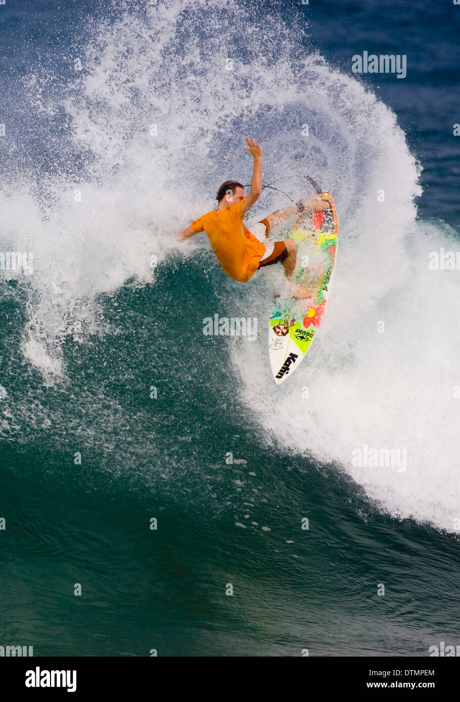 surfer on a surfboard riding a wave in the ocean sea water wave beach ...