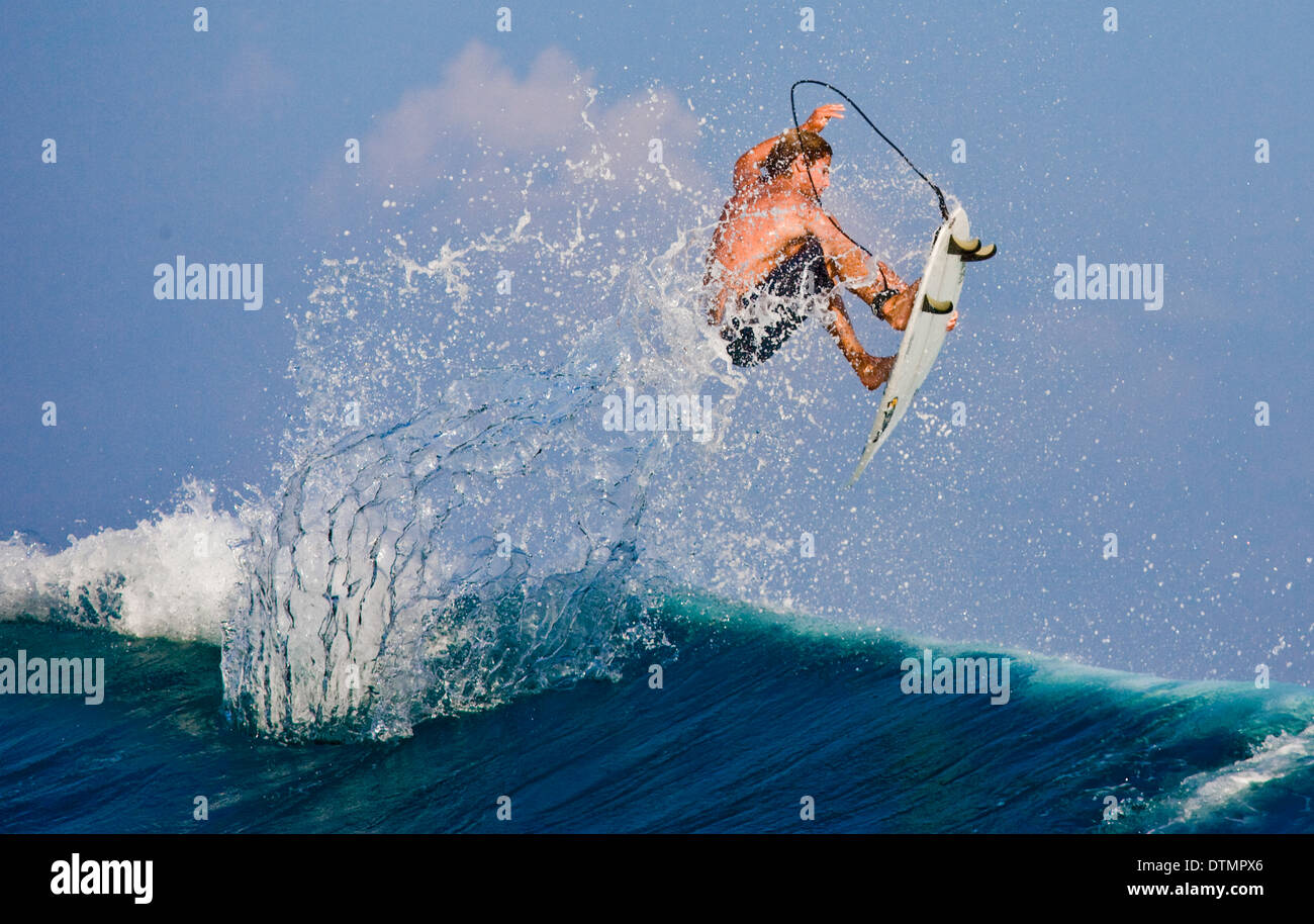 surfer on a surfboard riding a wave in the ocean sea water wave beach ...