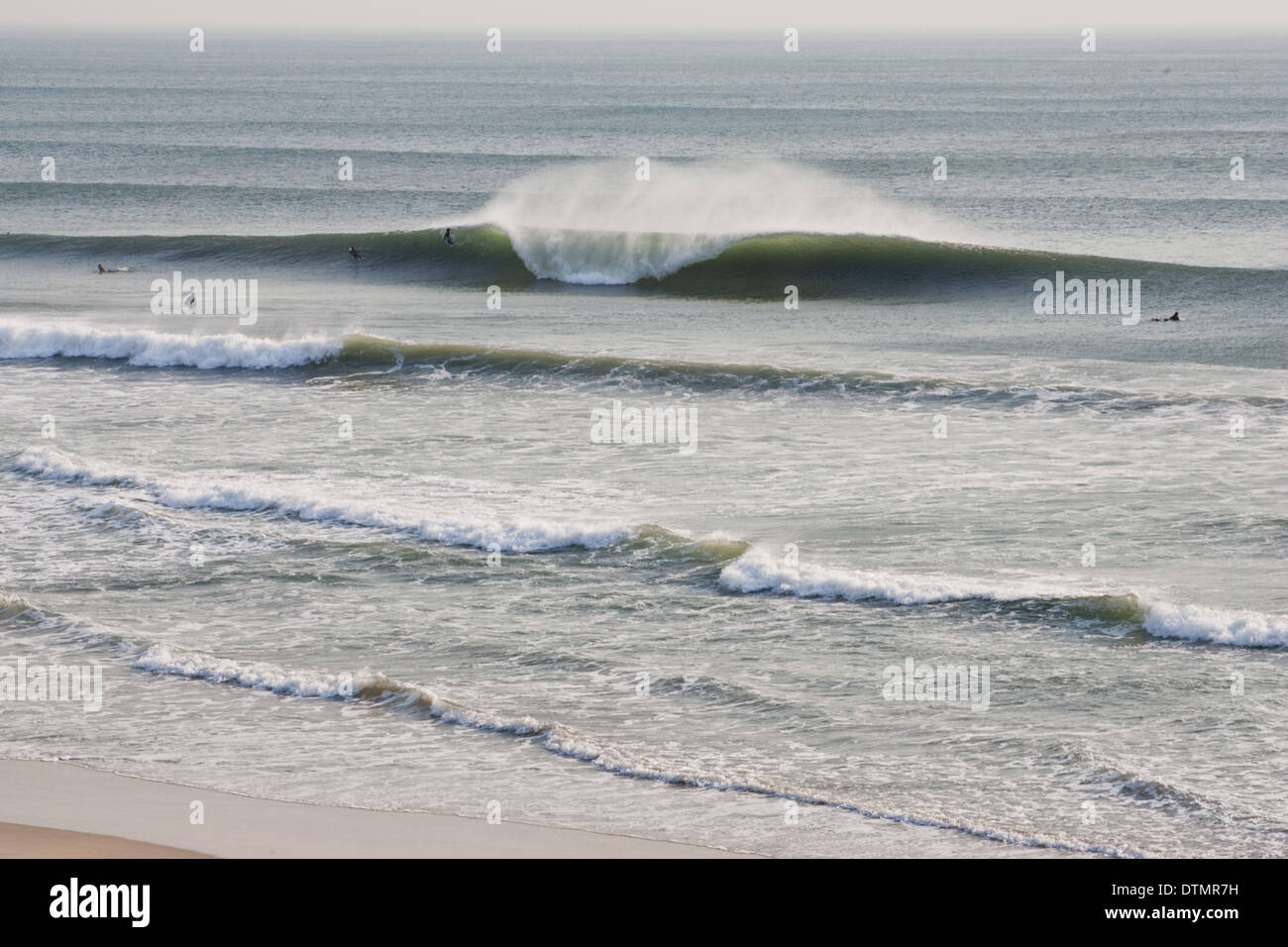 large huge massive swell wave in the ocean sea water with spray and a ...