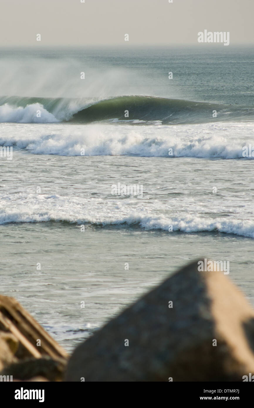 large huge massive swell wave in the ocean sea water with spray and a ...