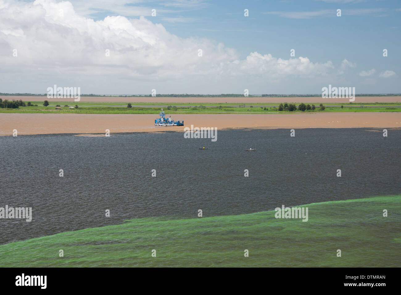 Brazil, Amazon River, Santarem. Amazon meets the clear water of the Rio ...