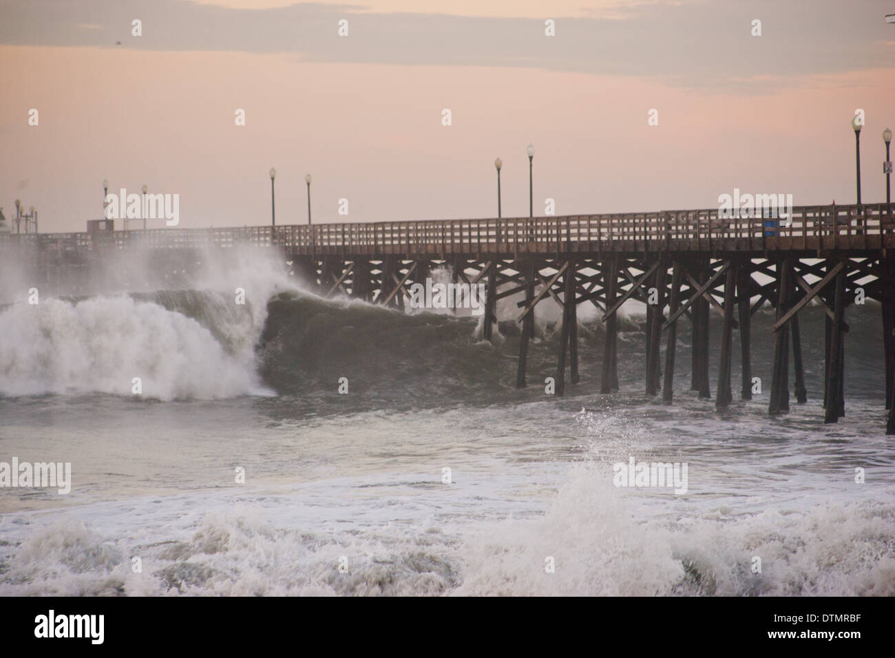 seal beach california pier with large huge massive waves crashing ...