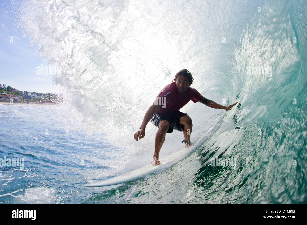 surfer on a surfboard riding a wave in the ocean sea water wave beach ...