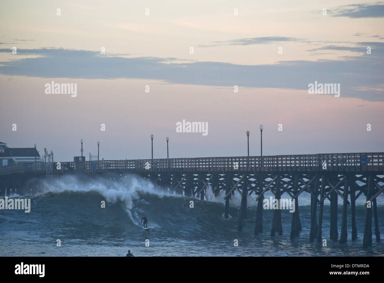 seal beach california pier with large huge massive waves crashing ...