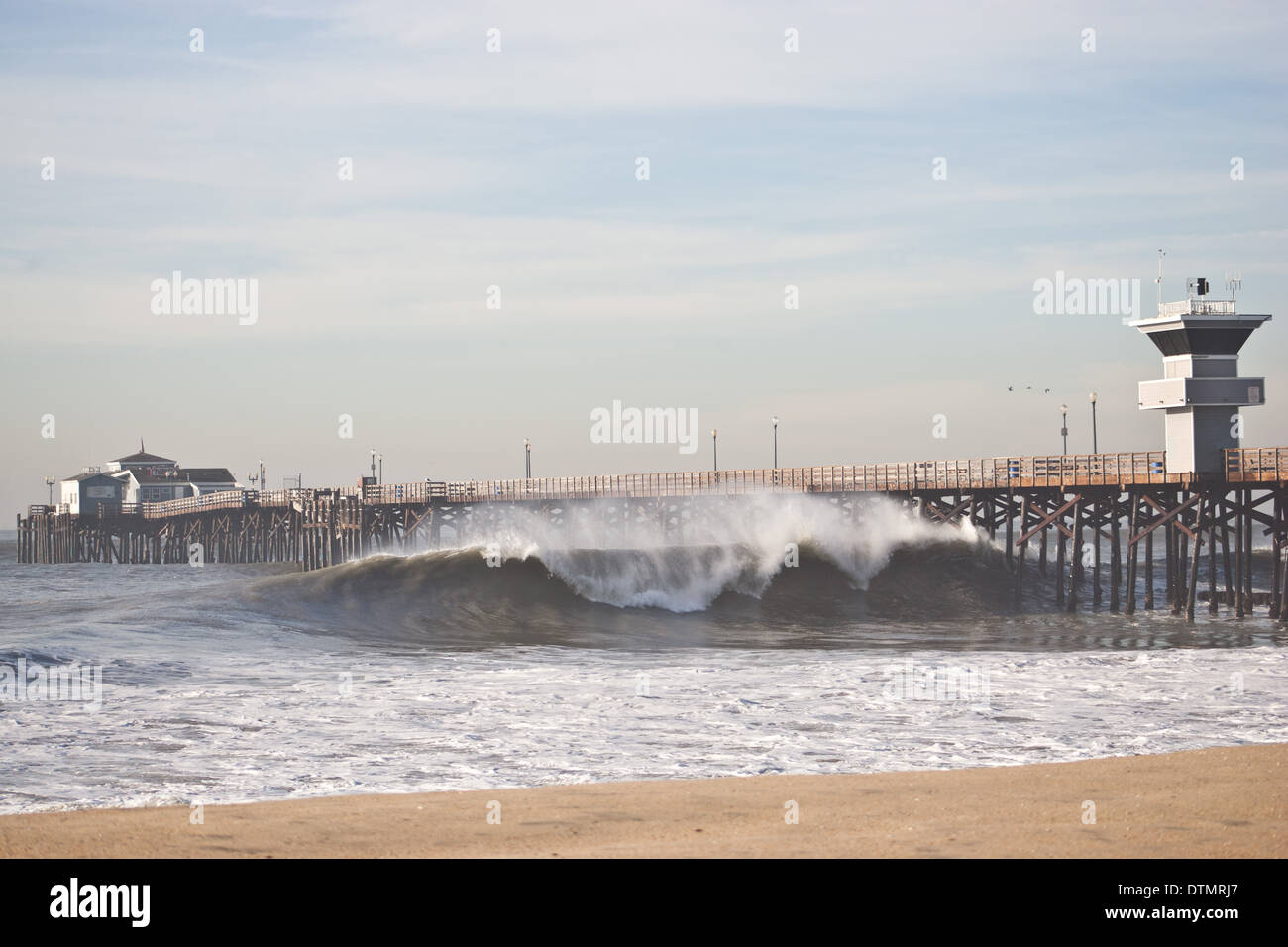 pier of seal beach california on a huge massive large wave wind day ...