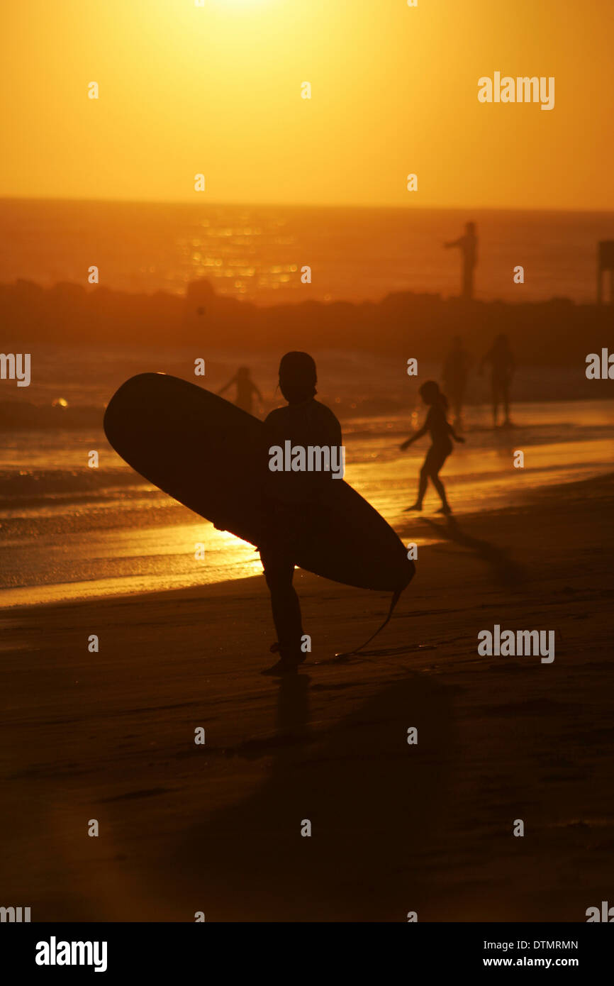 surfer with a surfboard on the beach ocean wave sea water waves Stock ...