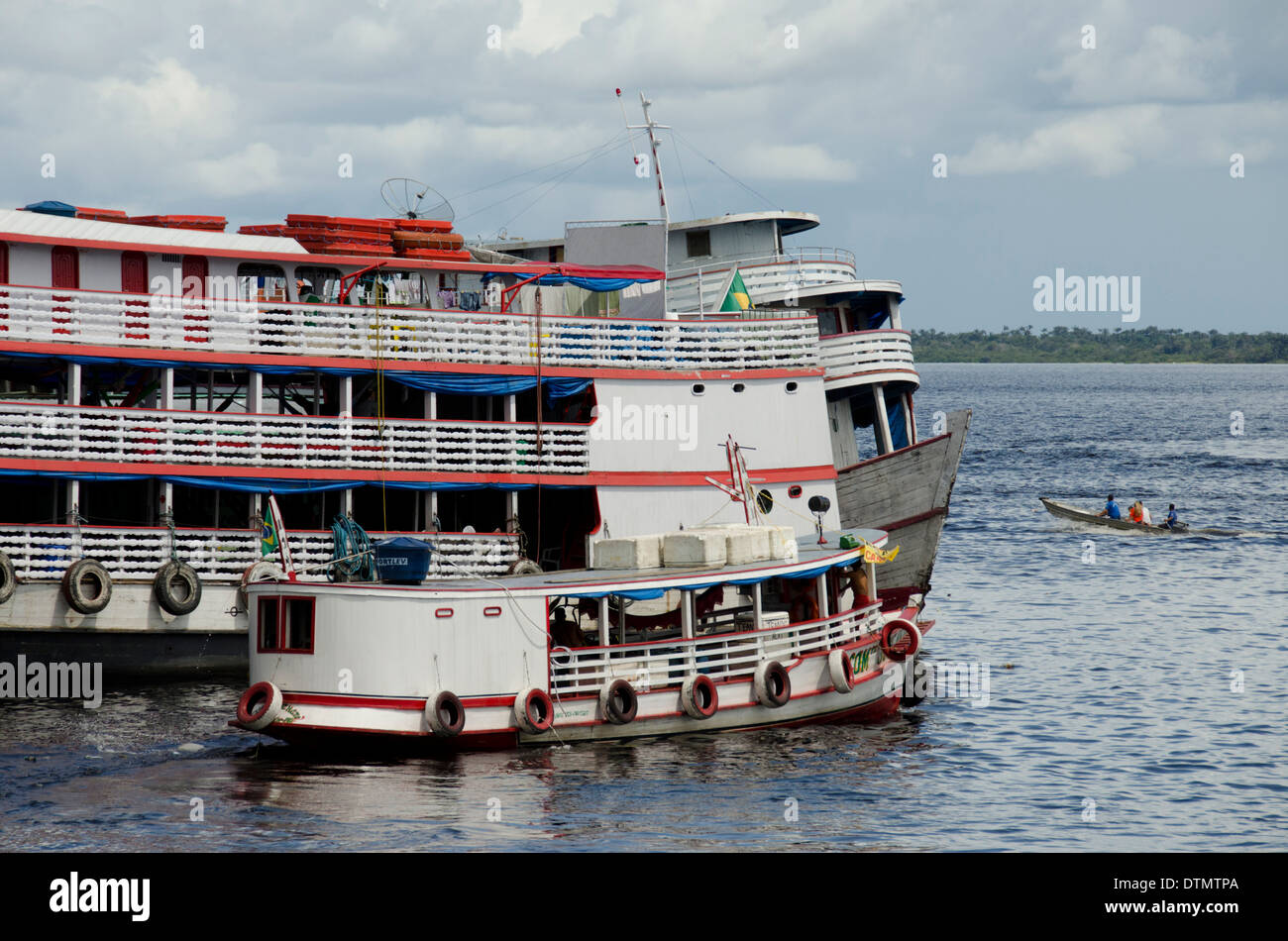 Brazil, Amazon, Manaus. Busy waterfront pier with traditional Amazon ...