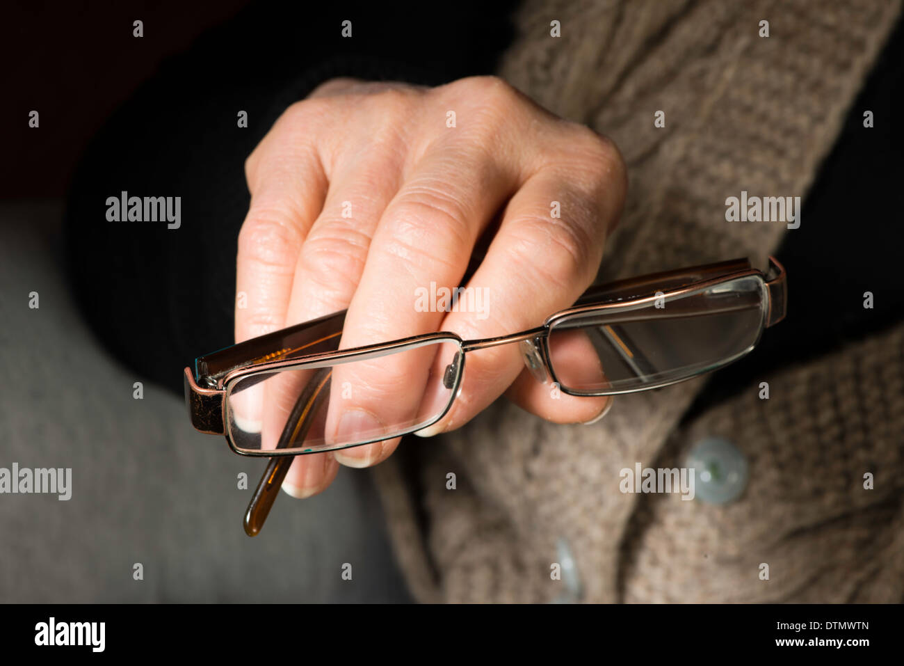 Old women hand hold glasses Stock Photo - Alamy