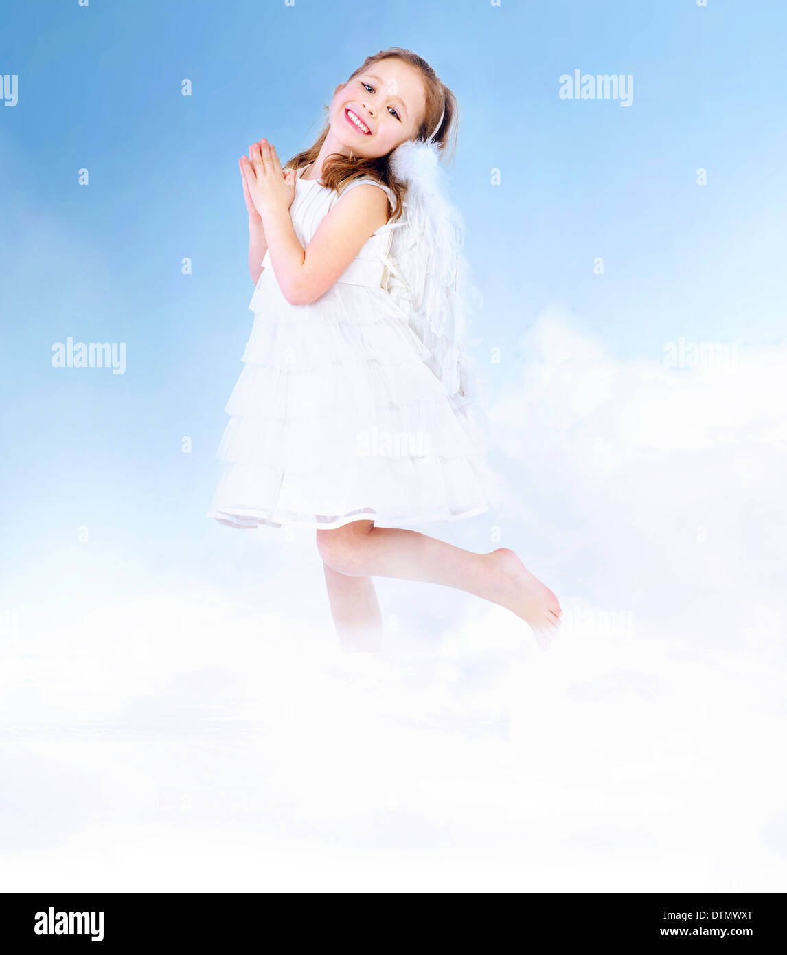 Angel kid girl with white wings Stock Photo - Alamy