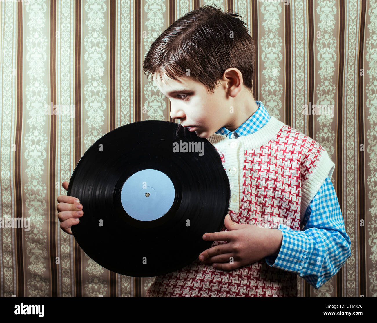 Child hold lp. Vontage clothes Stock Photo - Alamy
