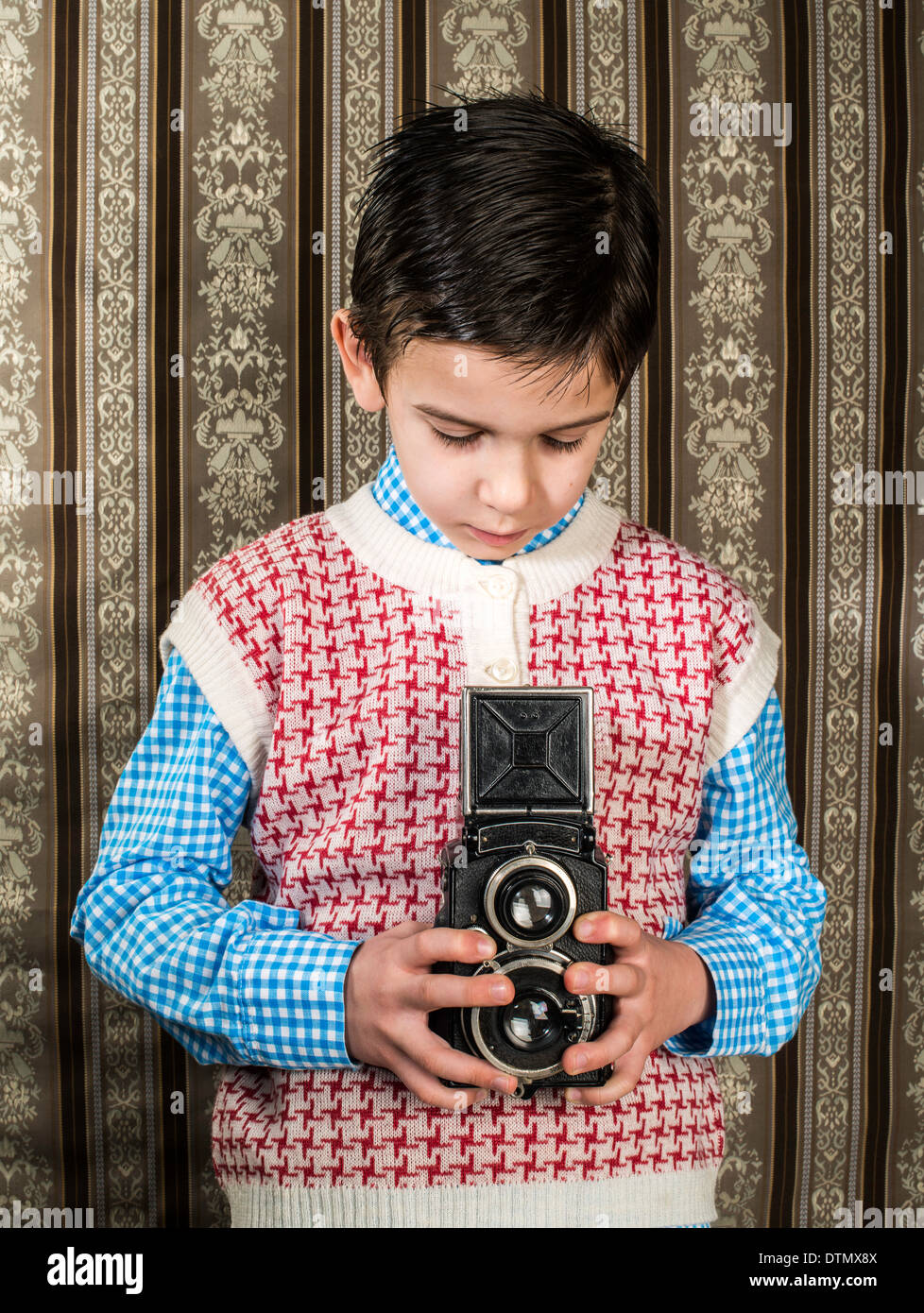 Boy with vintage camera. Vintage clothes Stock Photo - Alamy