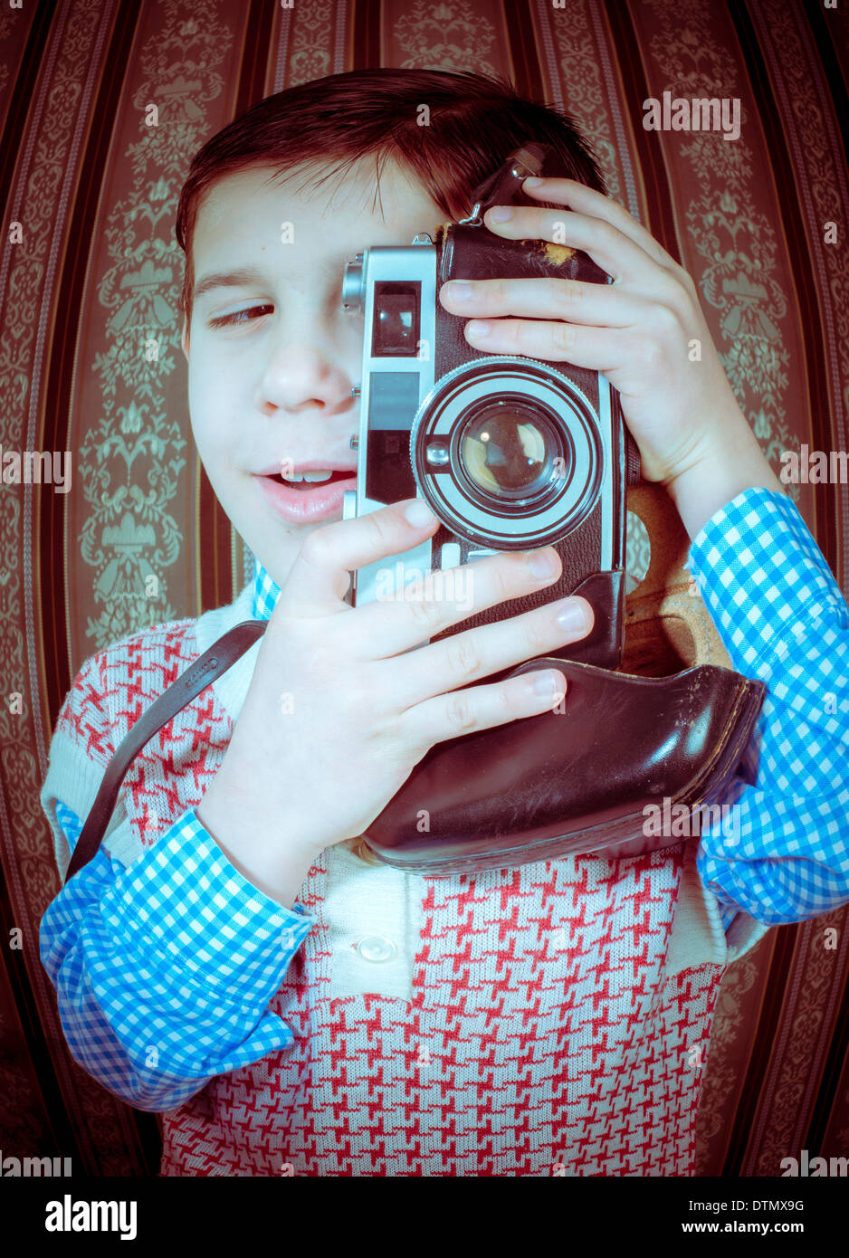 Boy with vintage camera. Vintage clothes Stock Photo - Alamy