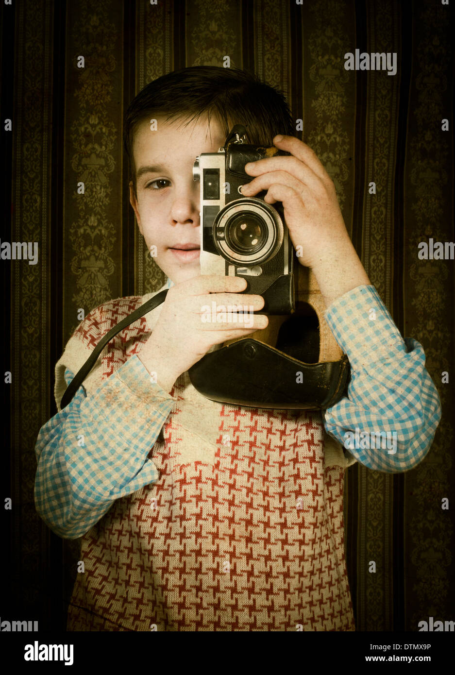 Boy with vintage camera. Vintage clothes Stock Photo - Alamy