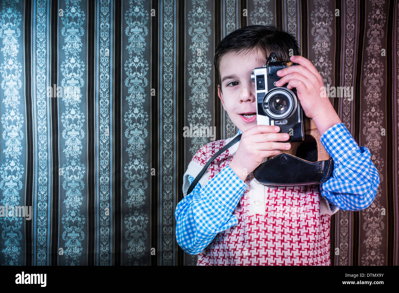 Boy with vintage camera. Vintage clothes Stock Photo - Alamy