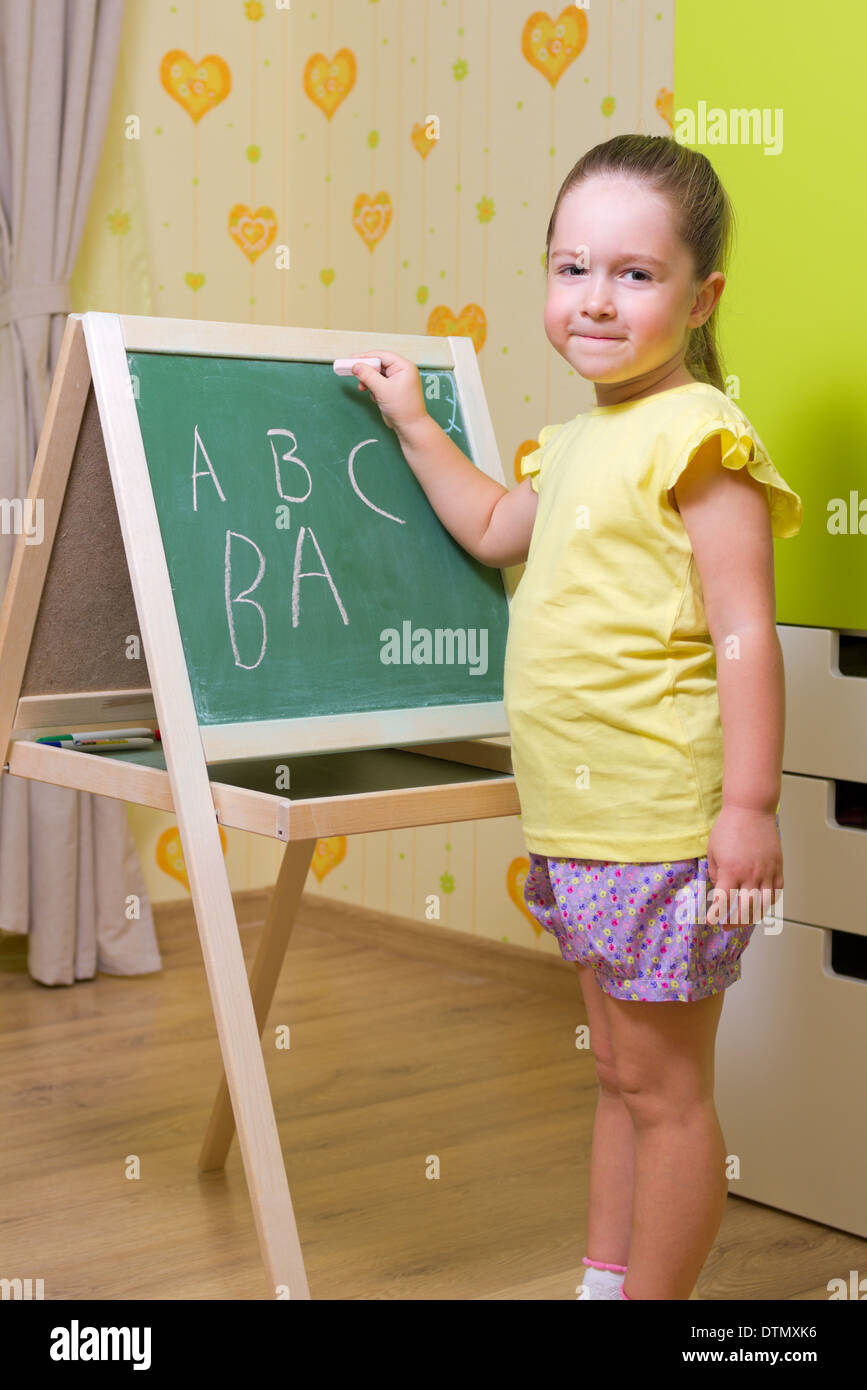 Little girl studying at home Stock Photo - Alamy