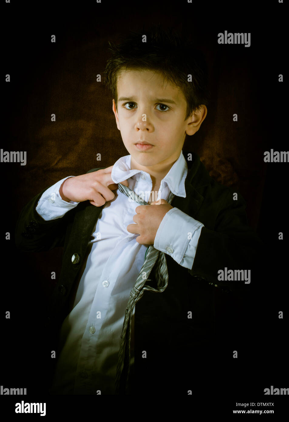 Boy in vintage black suit and tie Stock Photo - Alamy
