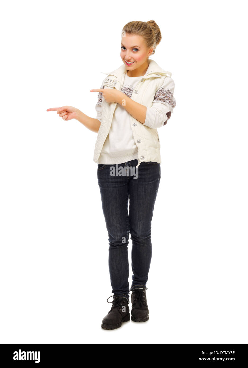 Young smiling girl show pointing gesture Stock Photo - Alamy