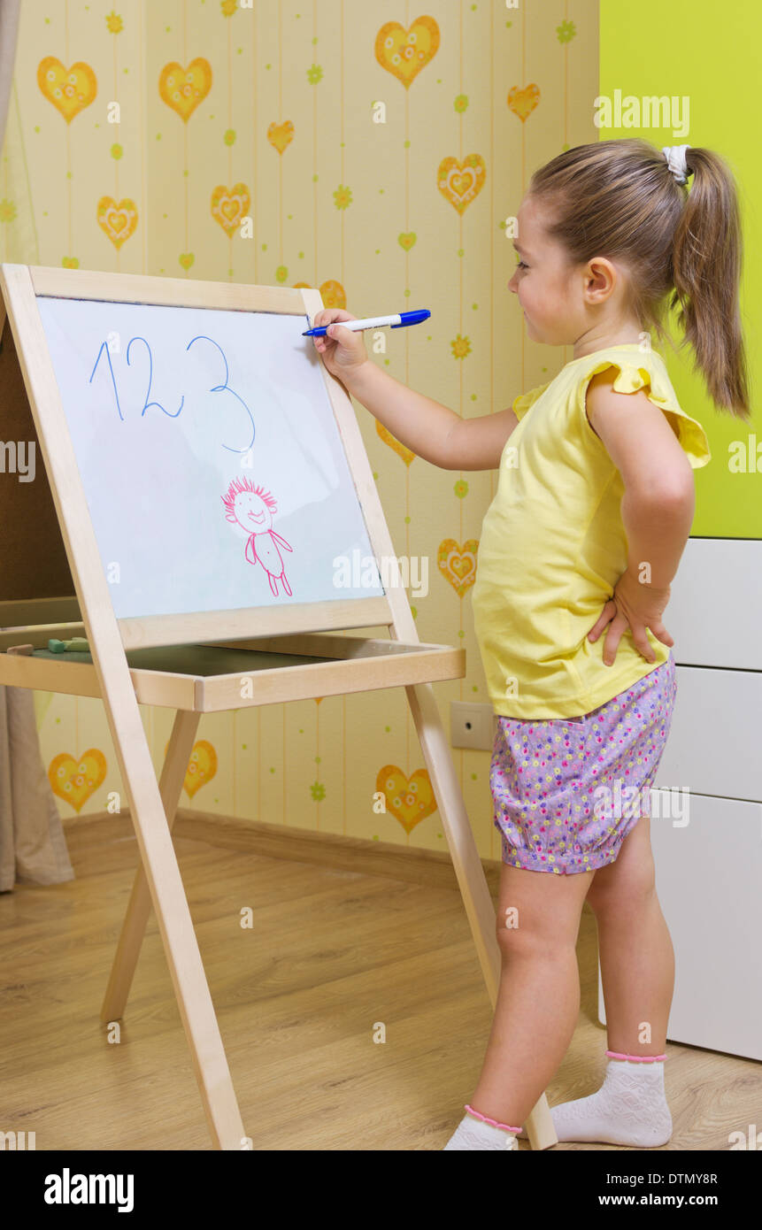 Child Writing On Whiteboard