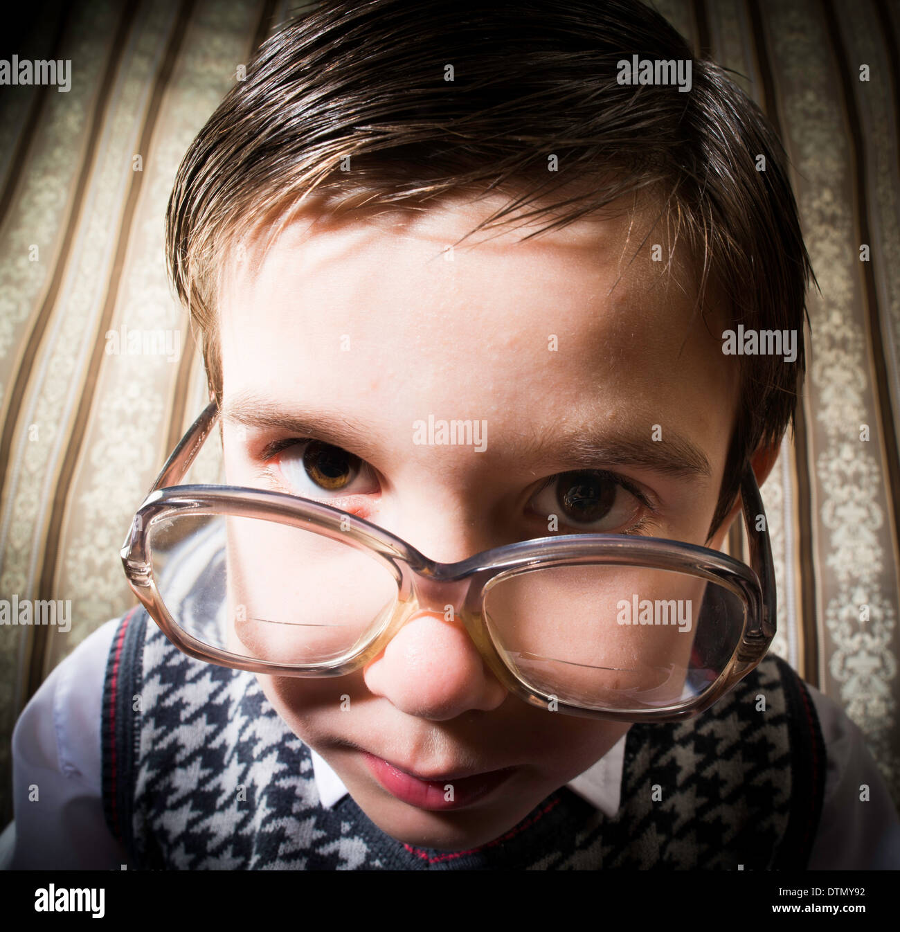 Smiling child with glasses in vintage clothes. Close up shot Stock ...