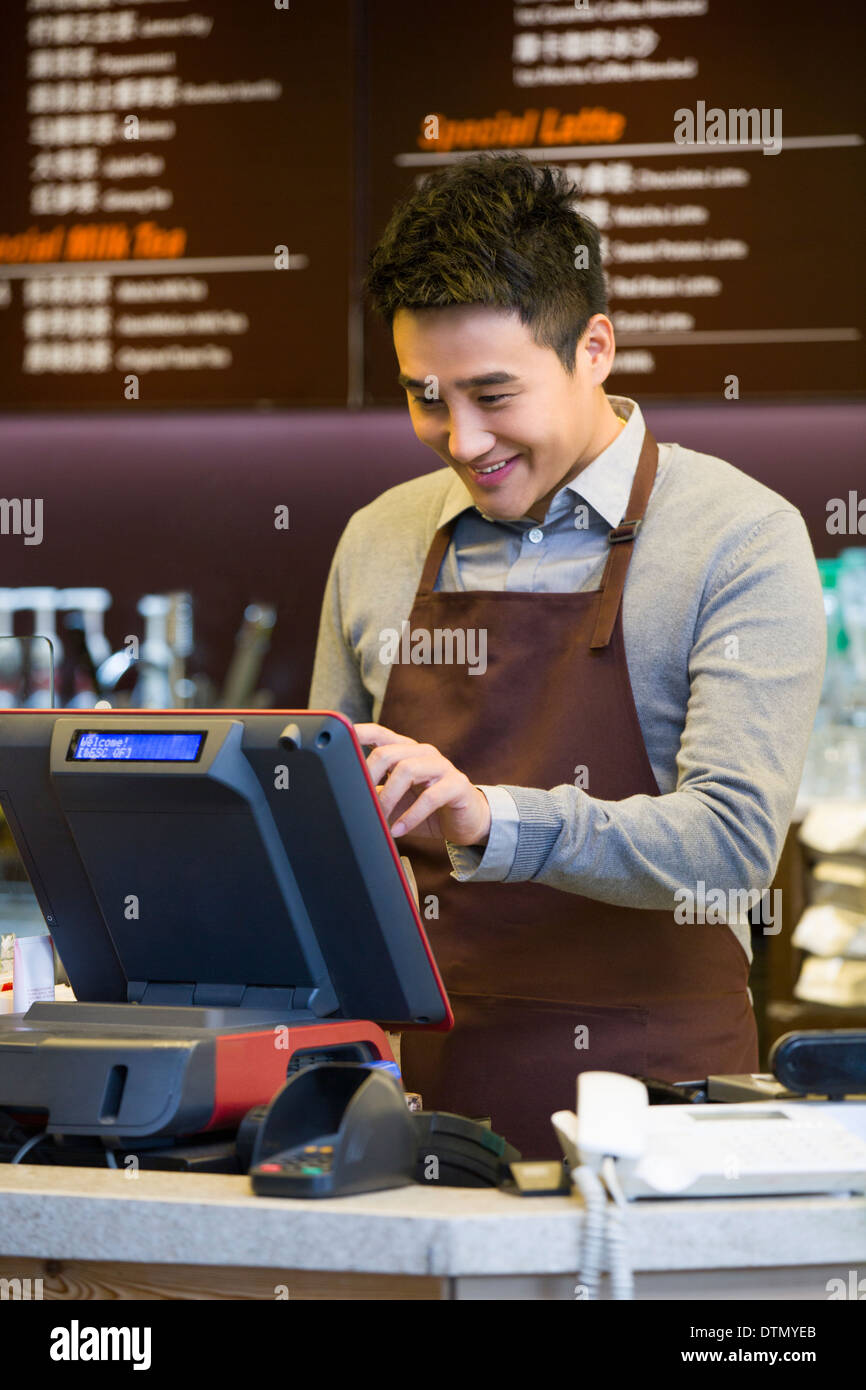 Store clerk at register hi-res stock photography and images - Alamy