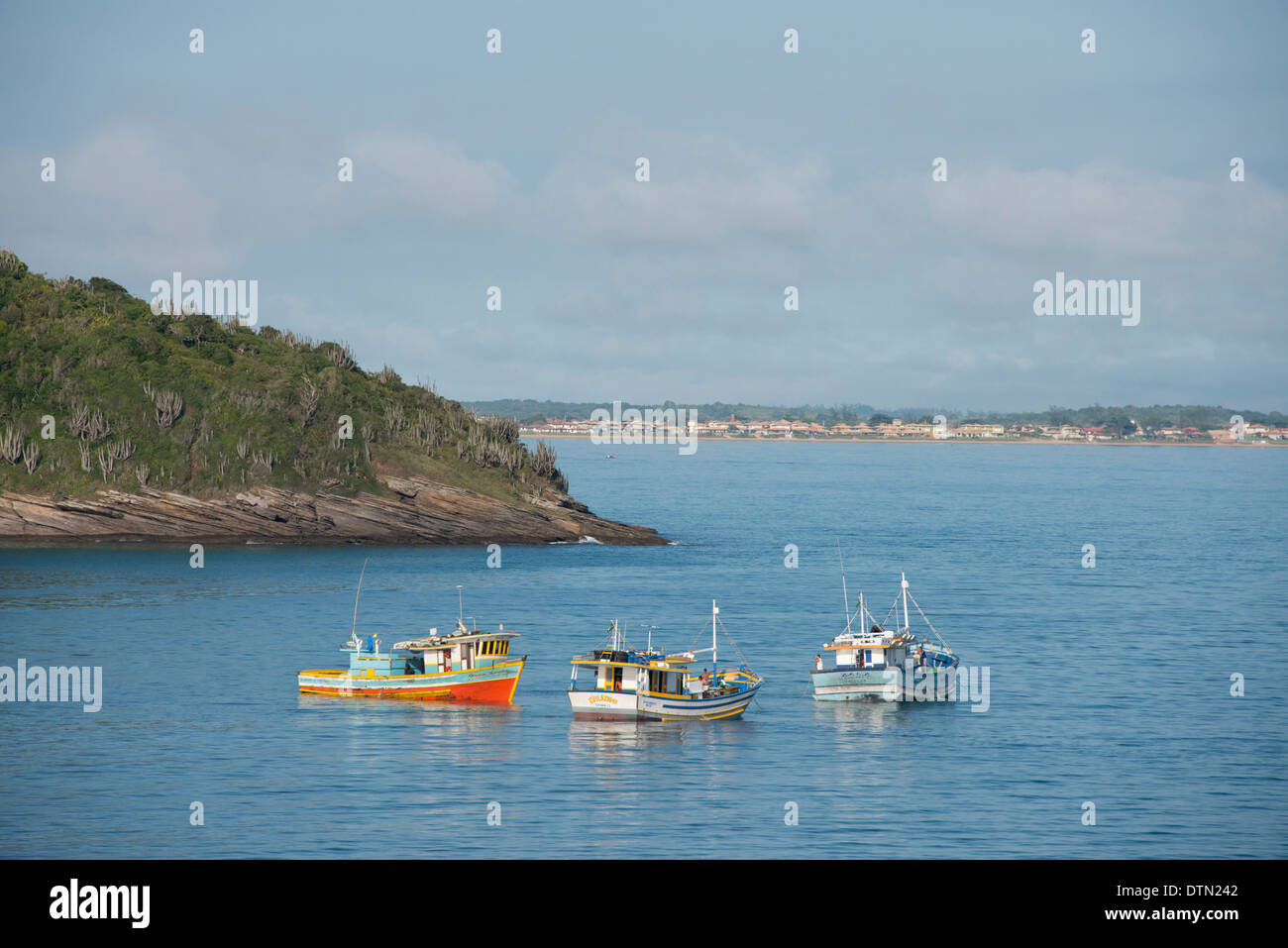 Brazil, Rio de Janeiro, Buzios. Colorful fishing boats off the coast of ...