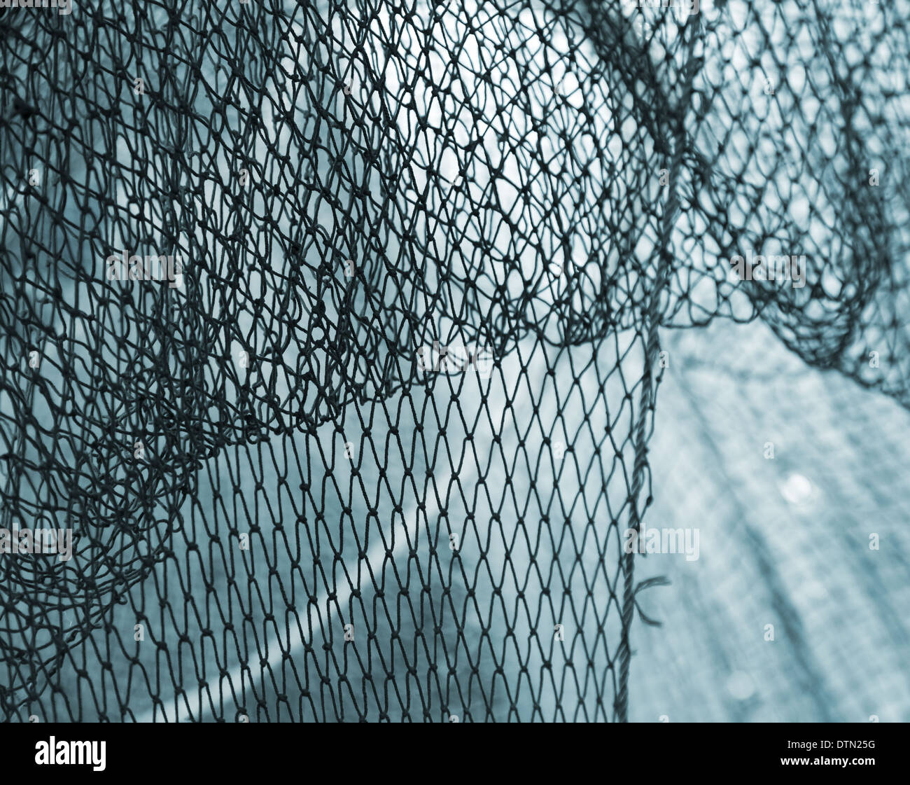 Old fishing net blue background. Photo with shallow depth of field ...