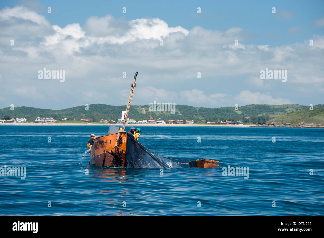 Brazil, Rio de Janeiro, Buzios. Local fishing boat off the coast of ...