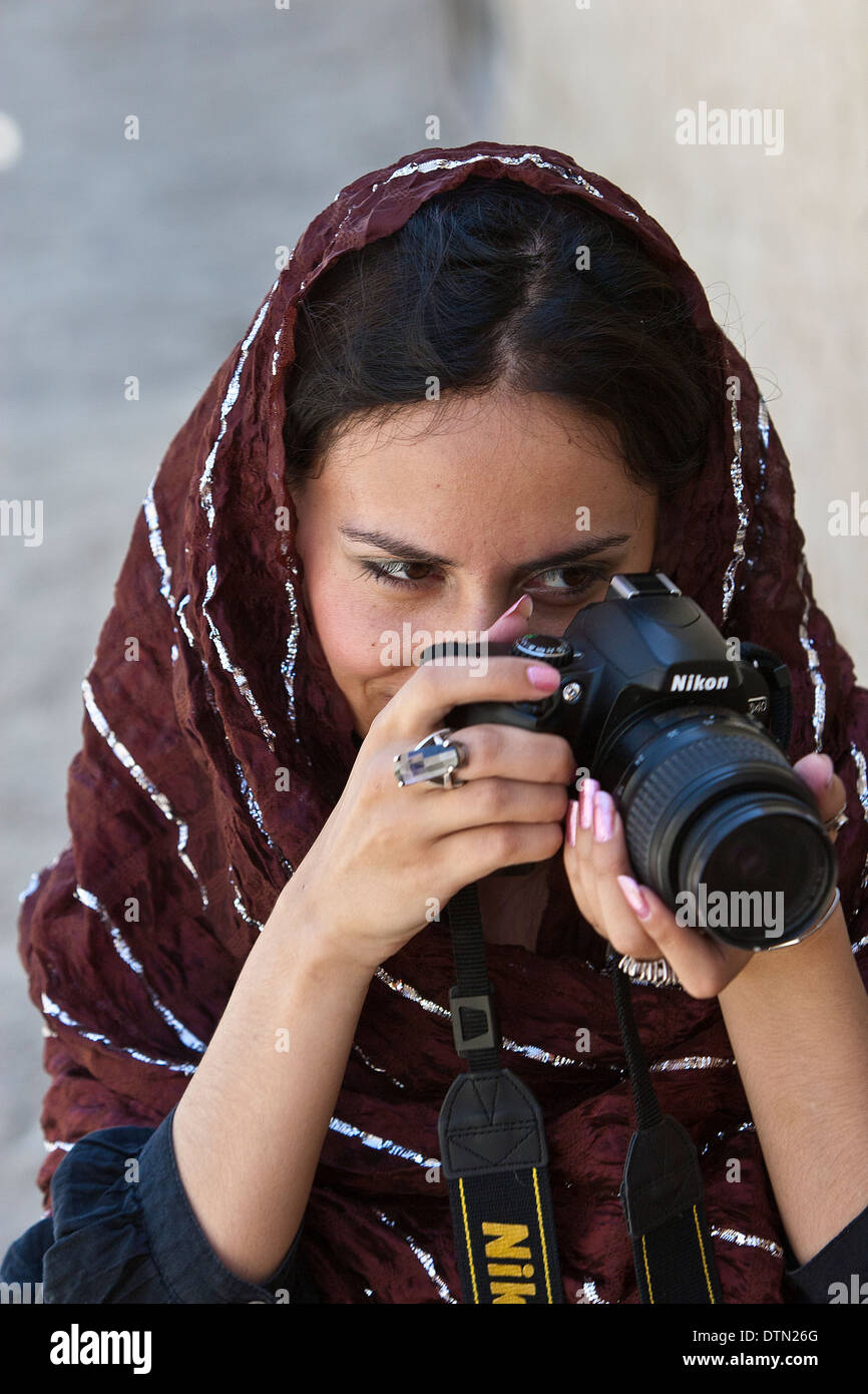 Young modern Afghan woman taking photographs in Kabul Afghanistan Stock Photo - Alamy
