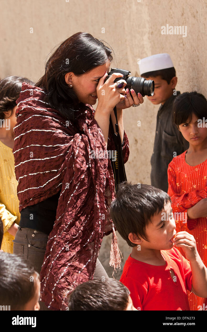 Young modern Afghan woman taking photographs in Kabul Afghanistan Stock Photo - Alamy