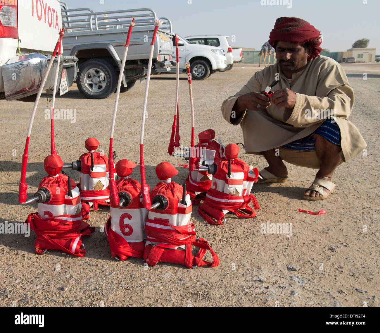 Remote controlled robot jockeys for sale at camel racing at Dubai Camel ...