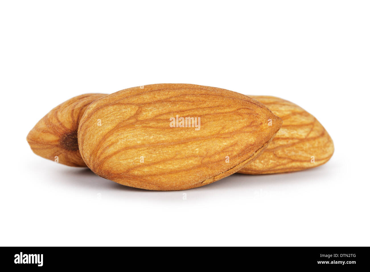 three almond nuts, isolated on white background Stock Photo - Alamy