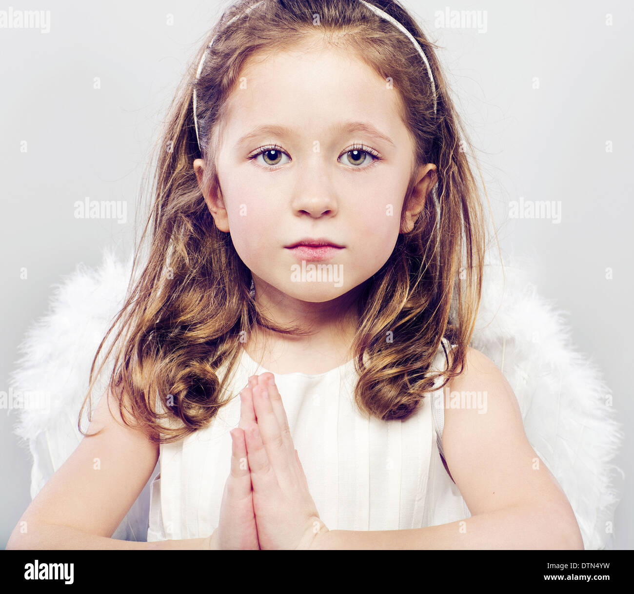 Picture of calm little girl with serious look Stock Photo - Alamy
