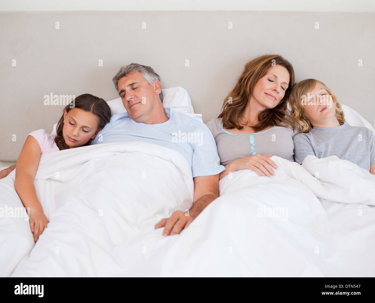 Family napping together Stock Photo - Alamy