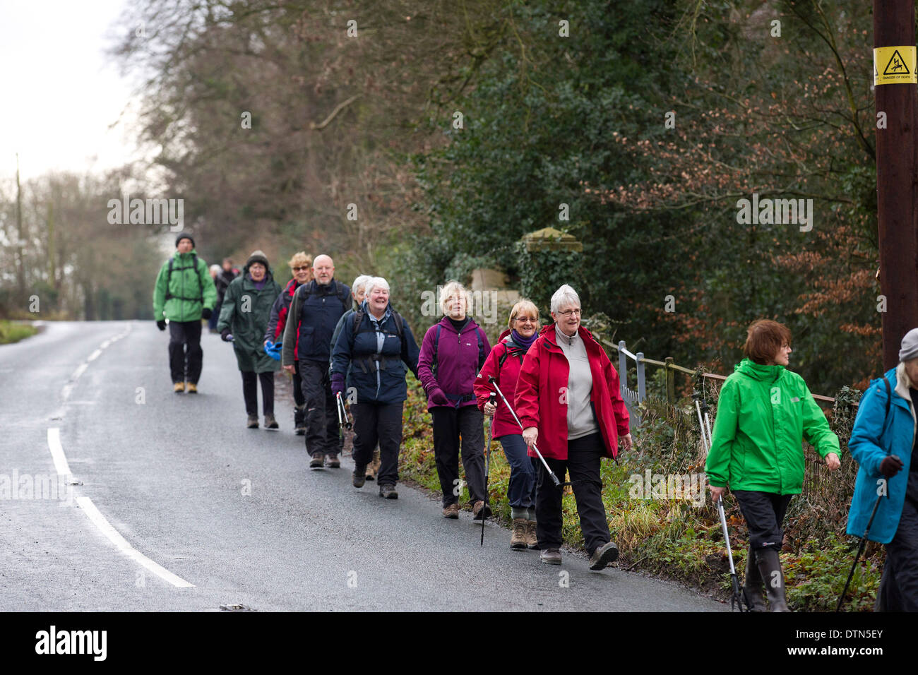 UK, Gloucestershire : A group of ramblers walk along the side of the ...