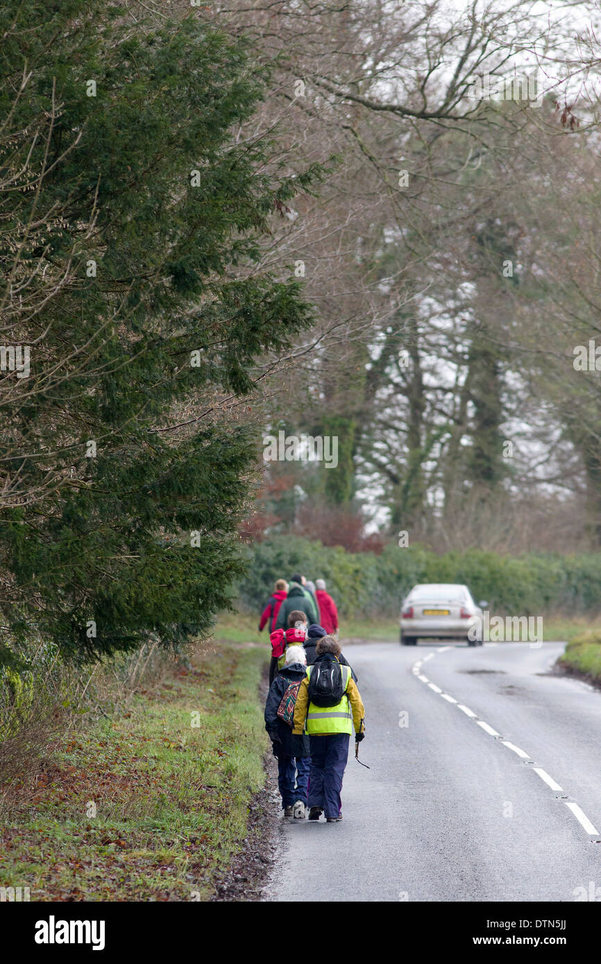 UK, Gloucestershire : A group of ramblers walk along the side of the ...