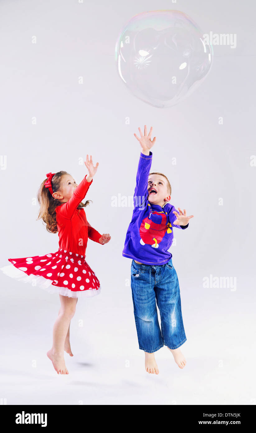 Two cute kids having great fun Stock Photo - Alamy