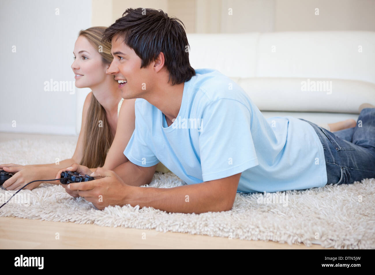 Couple playing video games Stock Photo - Alamy