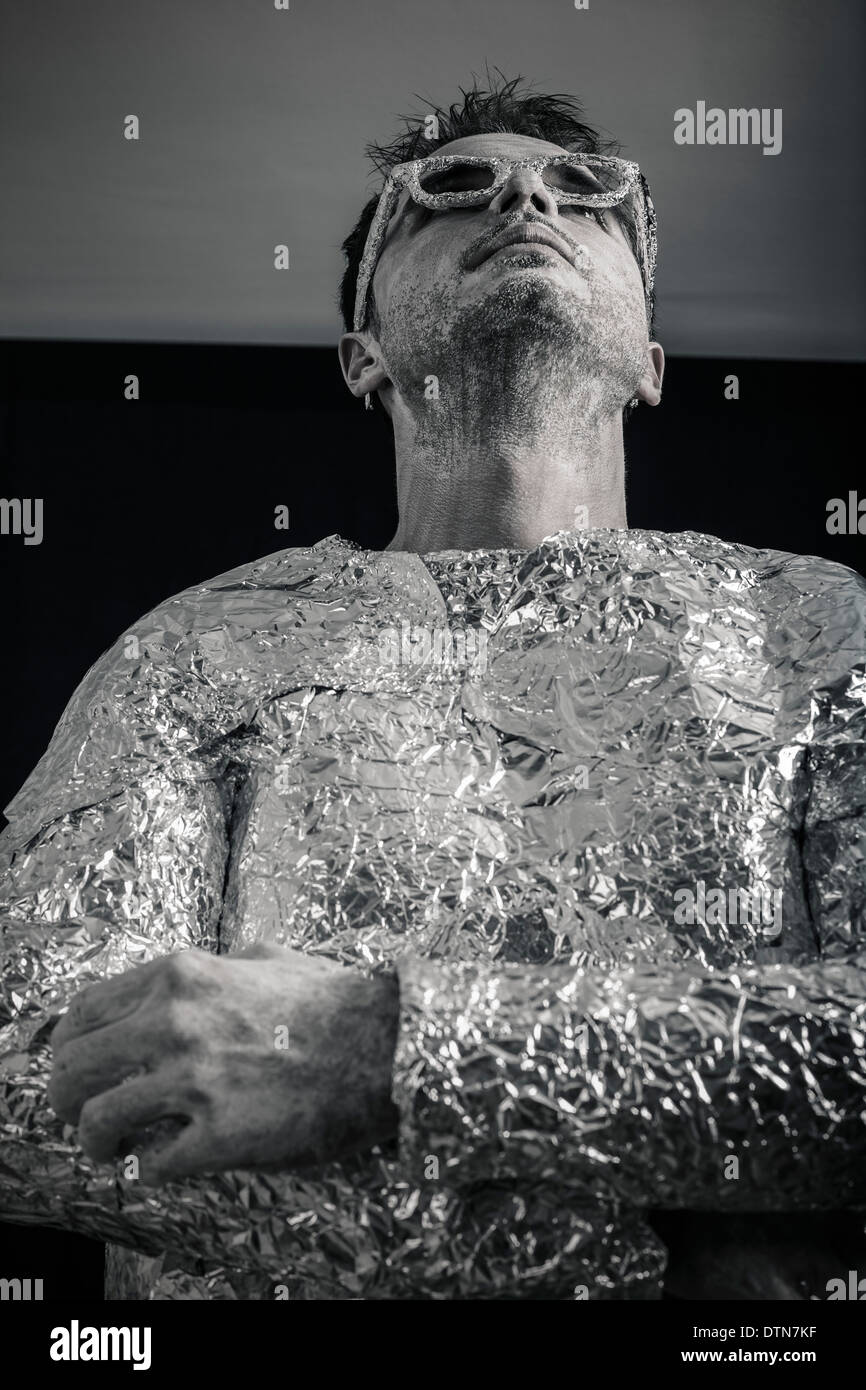 Portrait of pensive spaceman looking up Stock Photo - Alamy