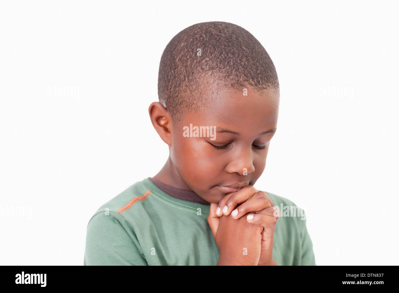 Calm boy praying Stock Photo - Alamy