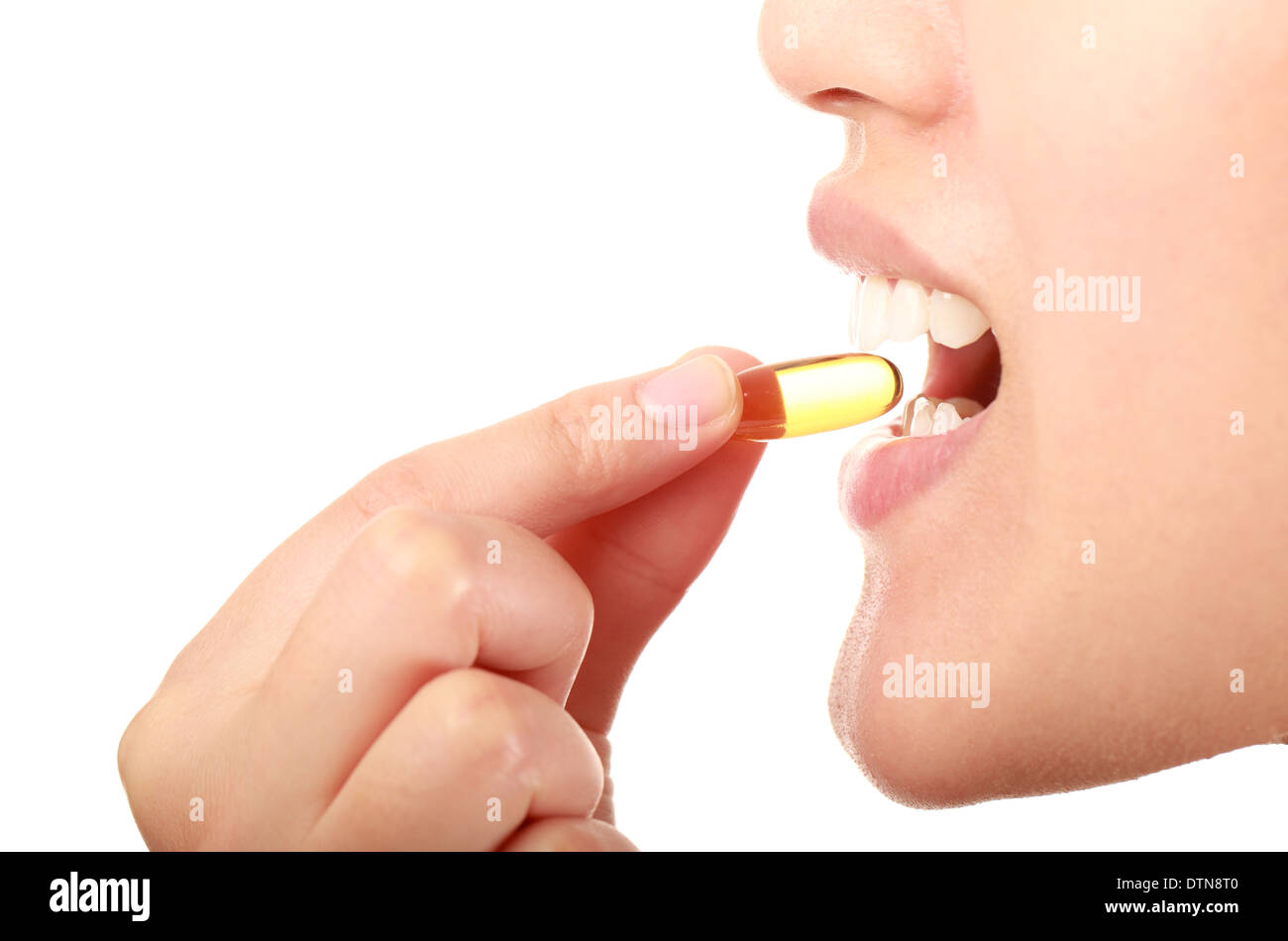 Asian woman eating a medicine on white background Stock Photo - Alamy