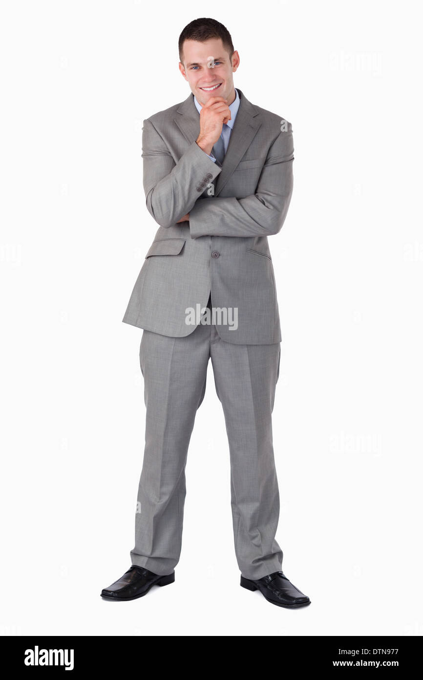 Smiling and thinking businessman Stock Photo - Alamy