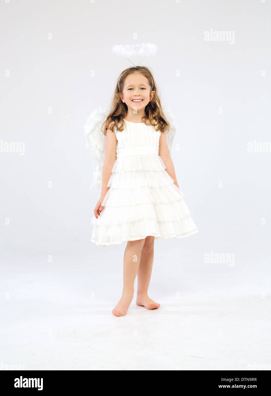 Cute little girl as an pure white angel Stock Photo - Alamy