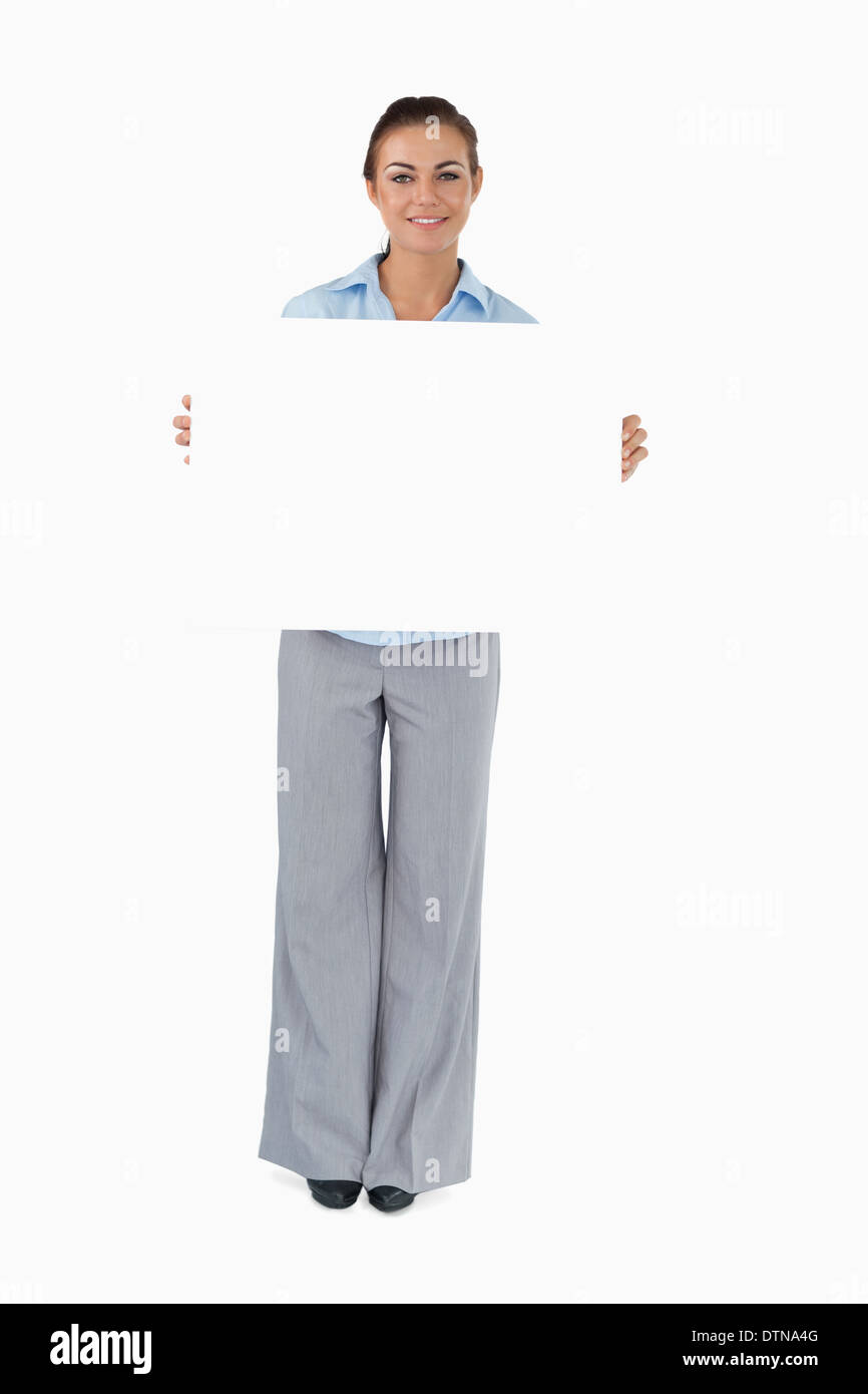 Businesswoman presenting sign Stock Photo - Alamy