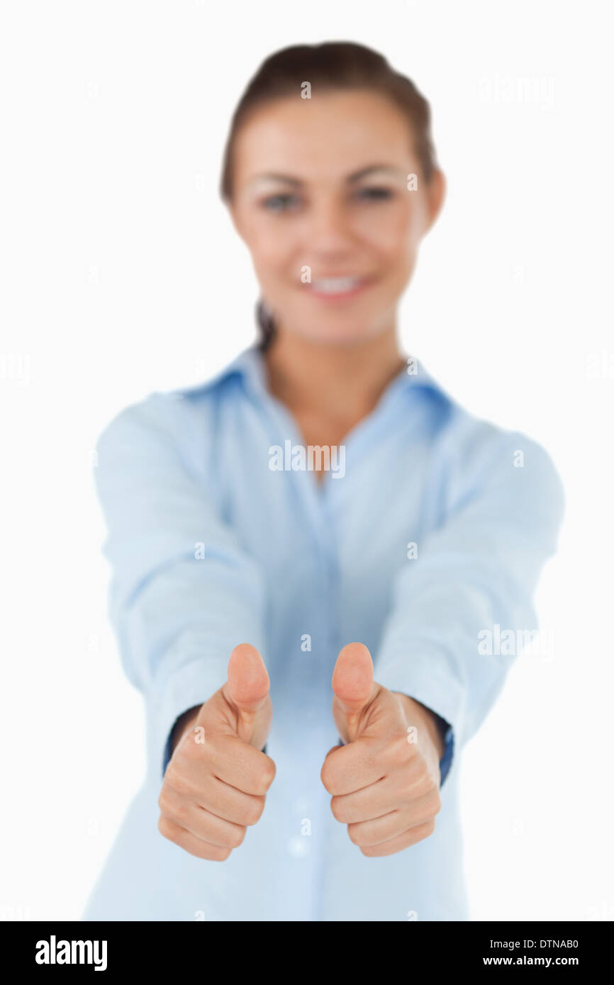 Attractive businesswoman giving thumbs up hi-res stock photography and ...