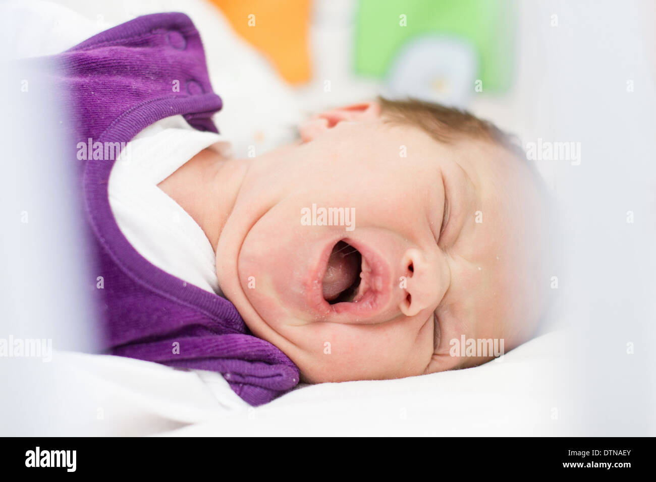 Portrait of crying newborn baby girl Stock Photo - Alamy