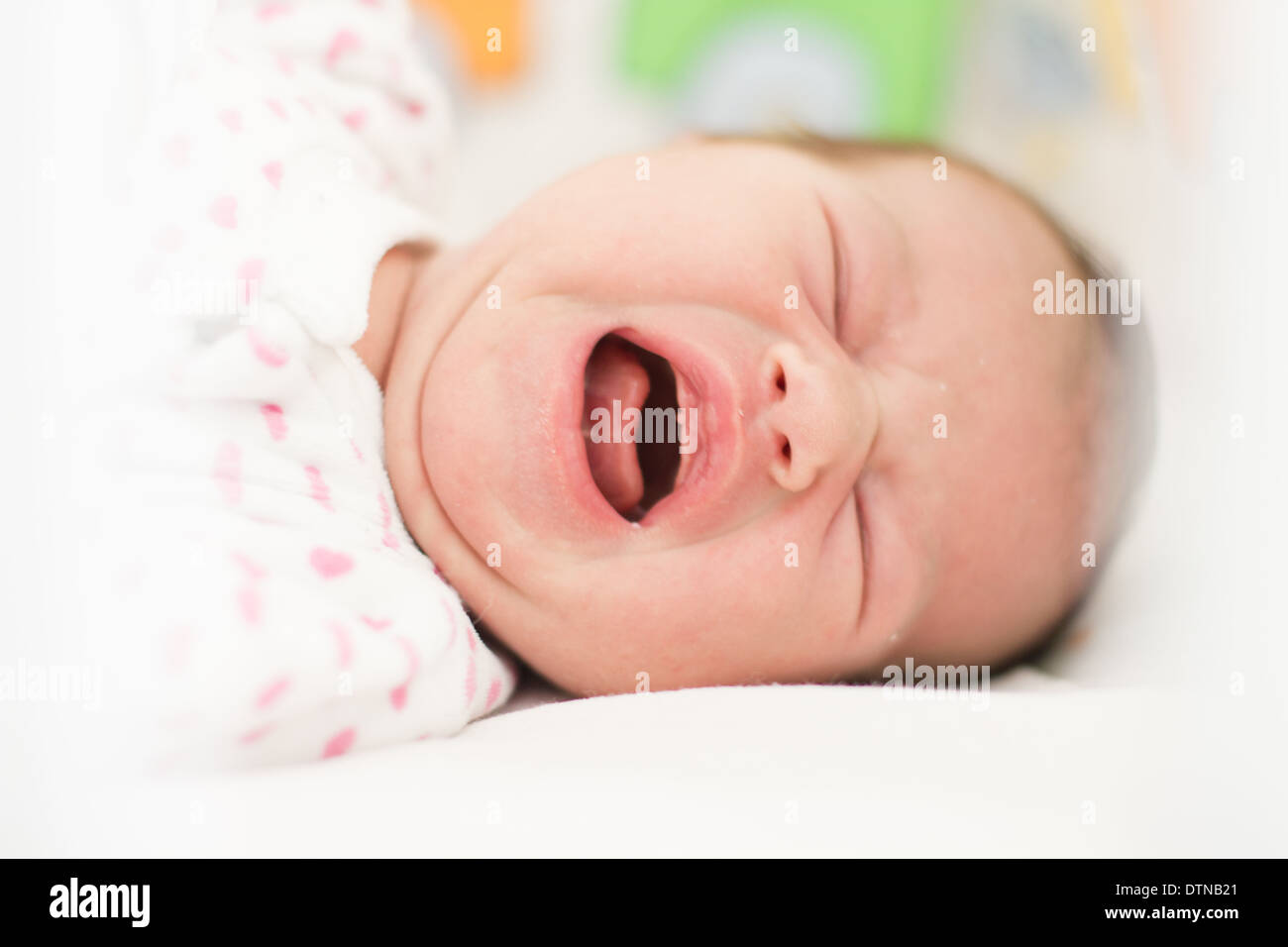 Portrait of crying newborn baby girl Stock Photo - Alamy