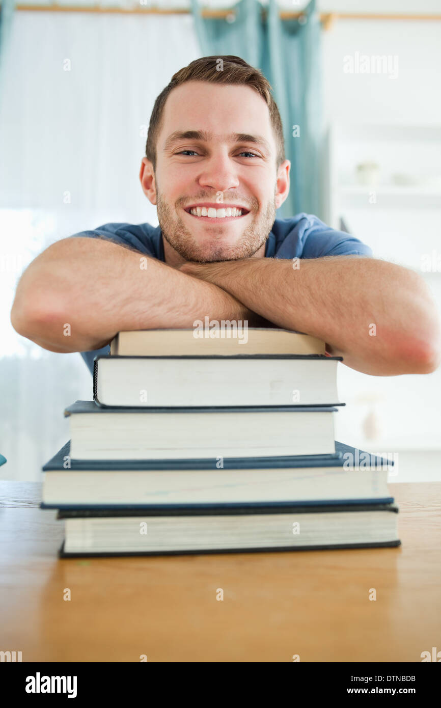 Happy student with his books Stock Photo - Alamy