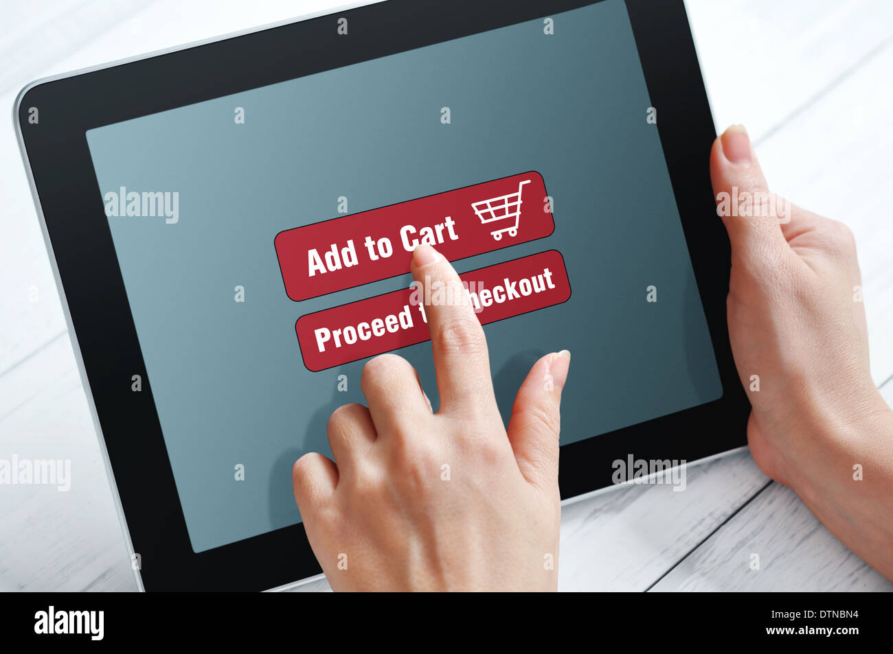 Female hands using touch screen device for online shopping Stock Photo ...